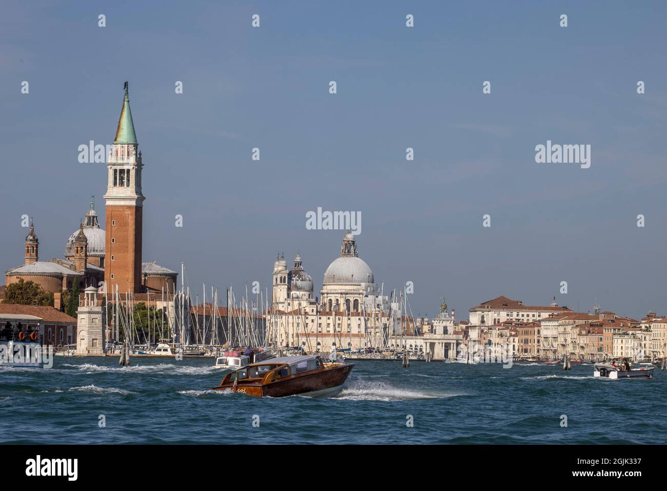 A boat passes the island of San Giorgio Maggiore which is opposite the ...