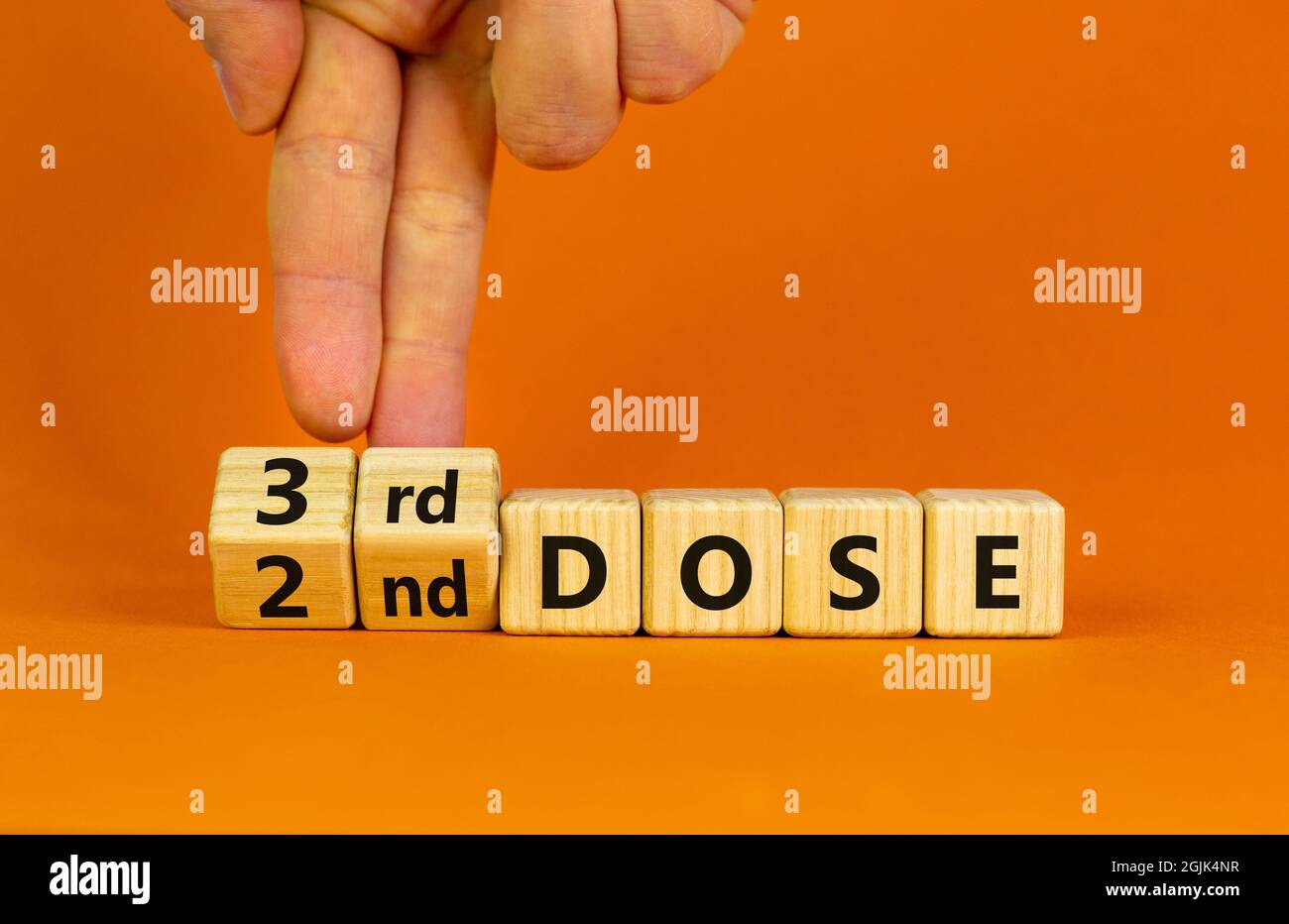 Covid-19 booster dose vaccine shot symbol. Doctor turns cubes and ...