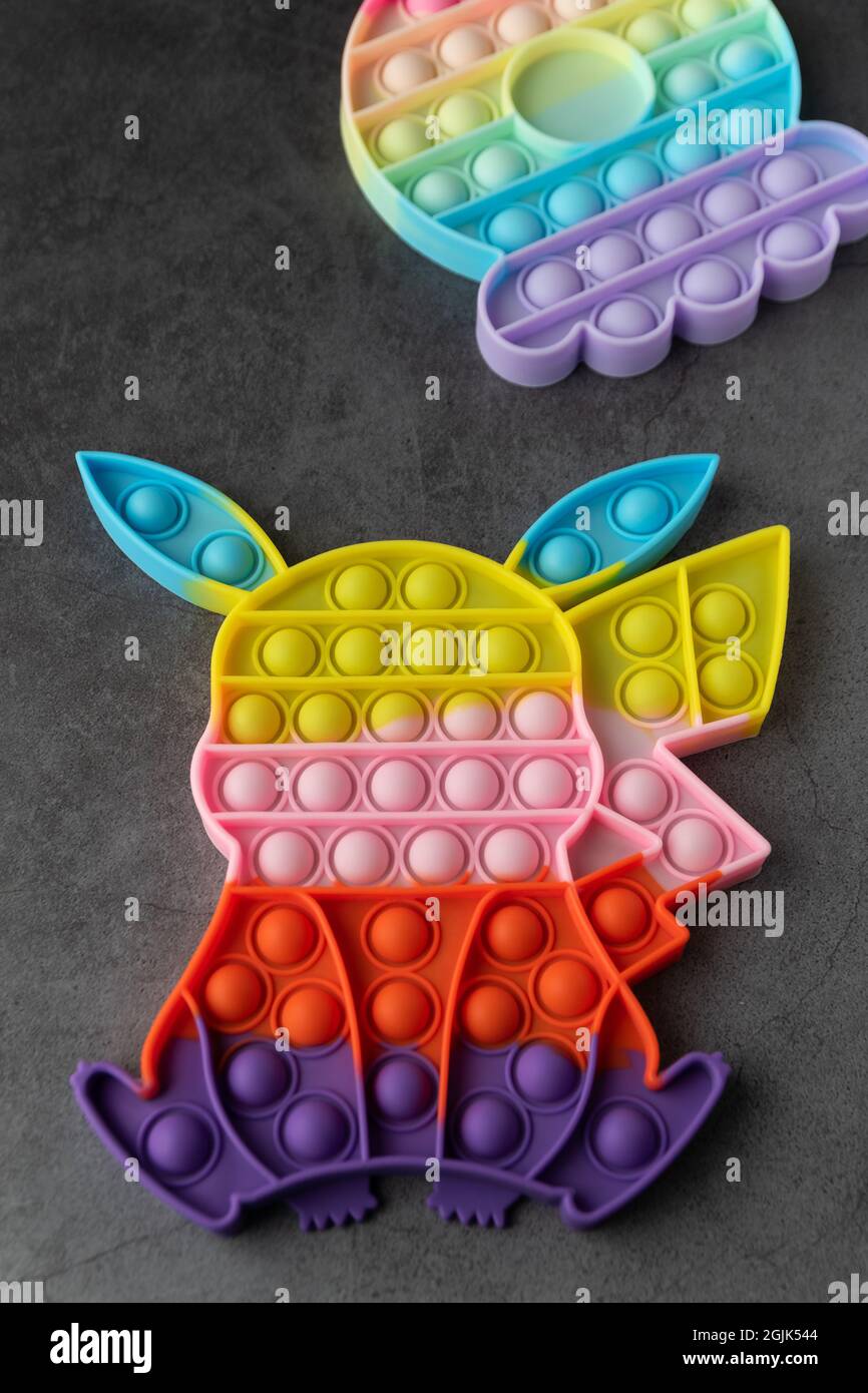 Pop it pokemon pikachu and octopus Stock Photo - Alamy