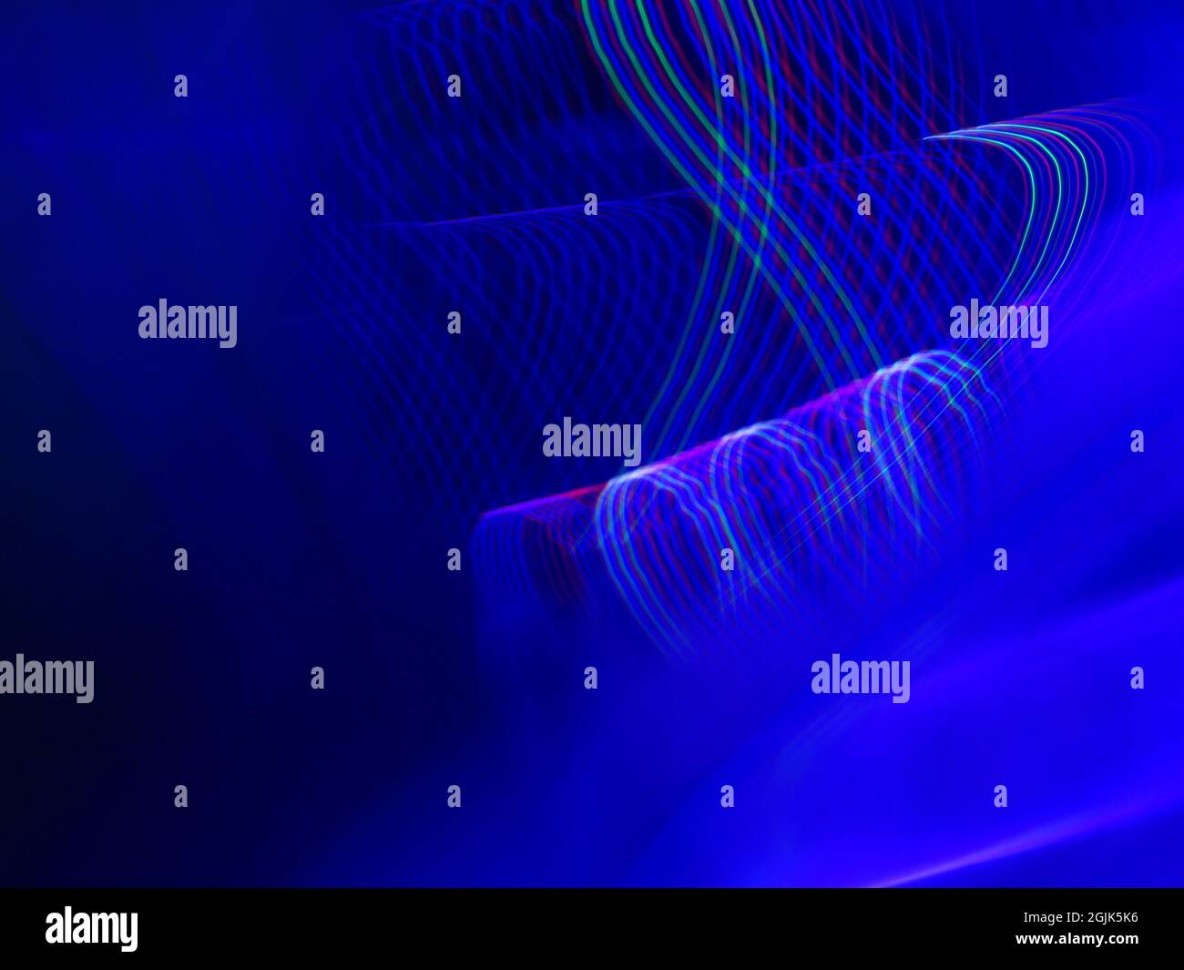 Neon abstract light trails background Stock Photo - Alamy