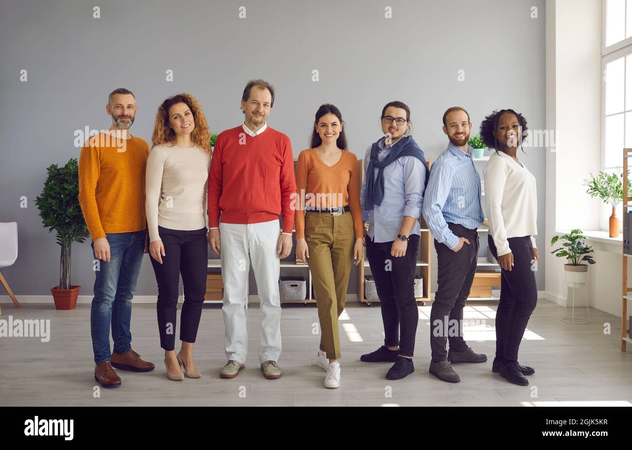 People group of different age and nationality standing in line posing ...