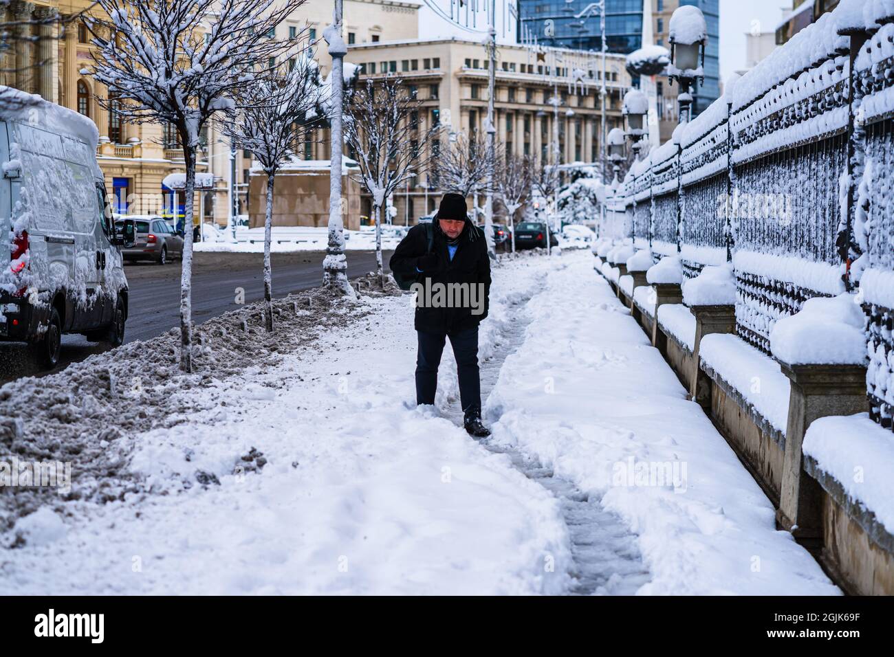 Walking on snowy trail in Bucharest, Romania, 2021. Snow on streets ...