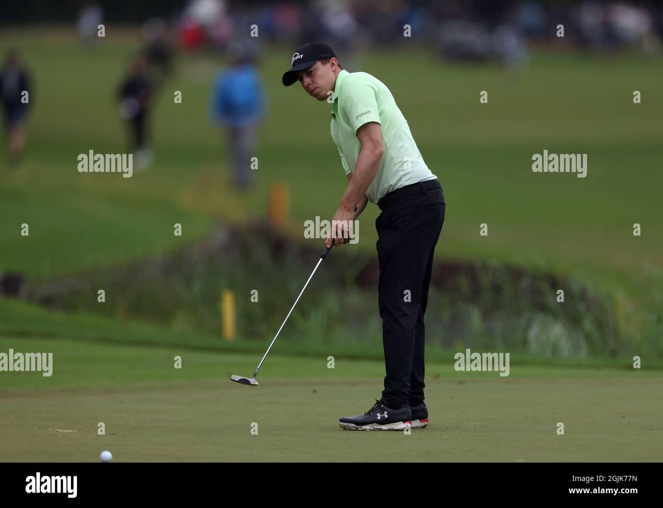 Matthew Fitzpatrick putting on the 18th during day two of the BMW PGA ...