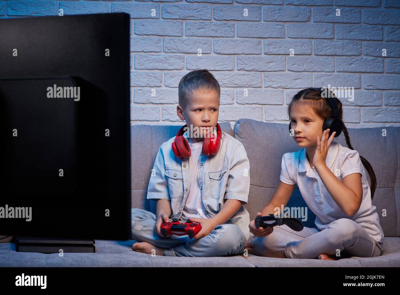 children playing video game with game console Stock Photo - Alamy