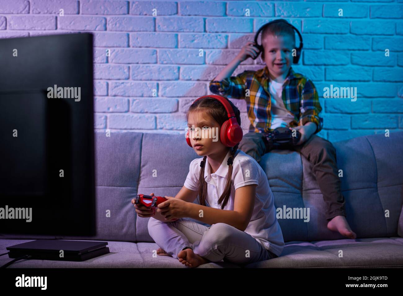 children playing video game with game console Stock Photo - Alamy