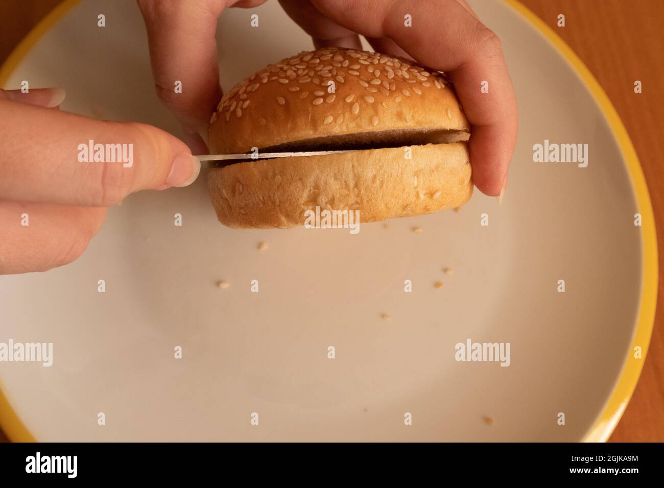 Knife cuts half delicious hamburger hi-res stock photography and images ...