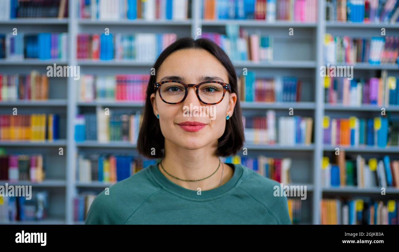Close-up portrait of a young woman student against the background of ...