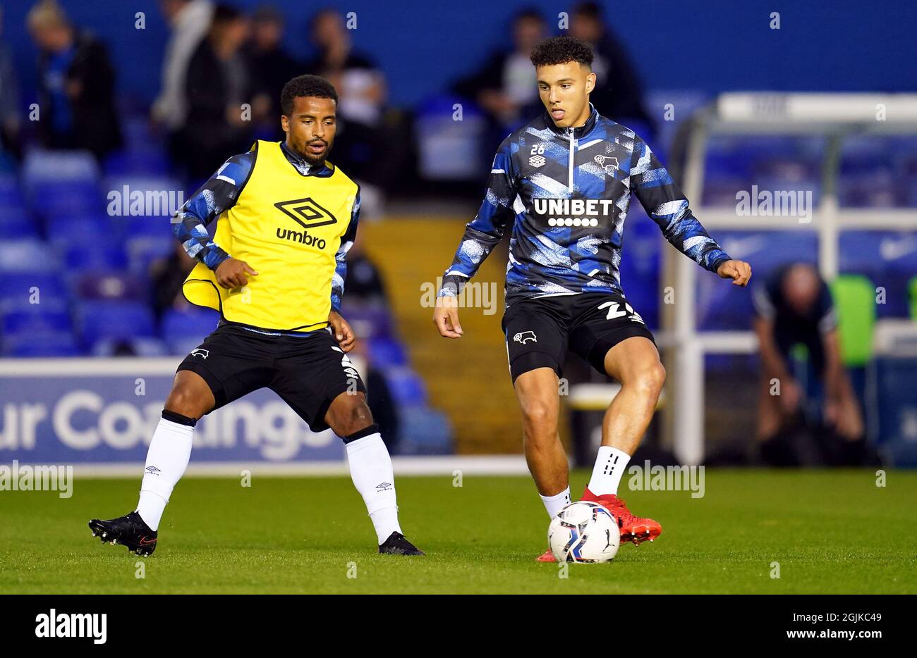Derby County's Lee Buchanan (right) warms up before the Sky Bet ...