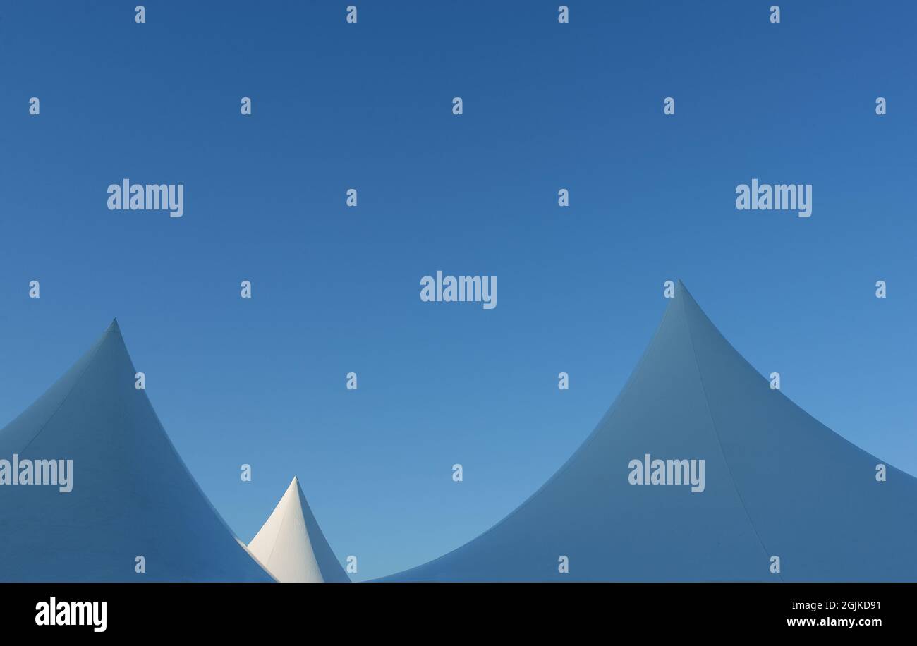 Cone shaped tents against clear blue sky, minimalism concept Stock ...