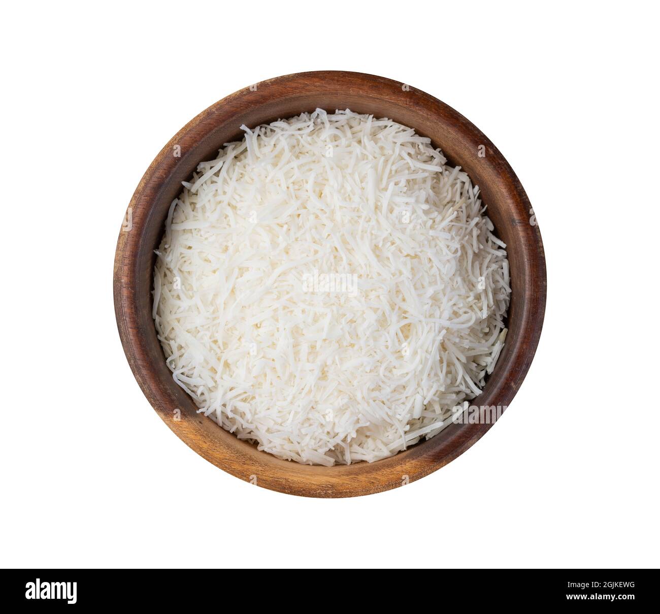 Grated coconut flakes in a bowl over wooden table Stock Photo - Alamy