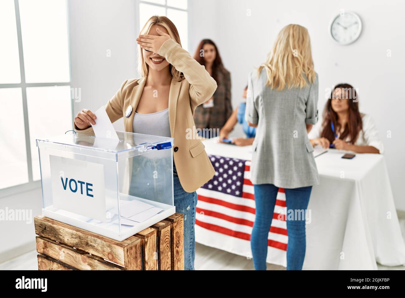Group of young girls voting at democracy referendum smiling and ...