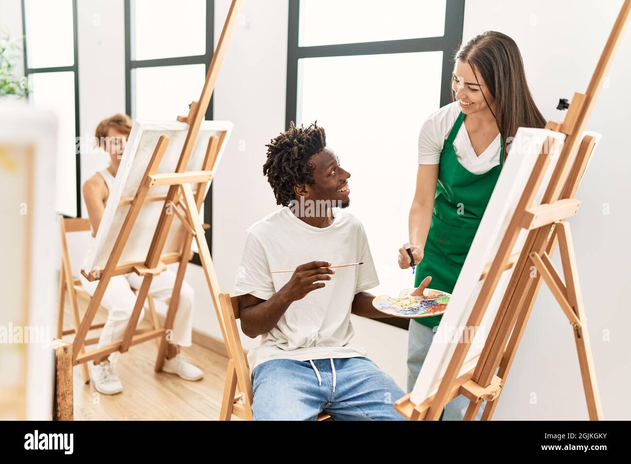 Group of people smiling happy drawing at art studio Stock Photo - Alamy
