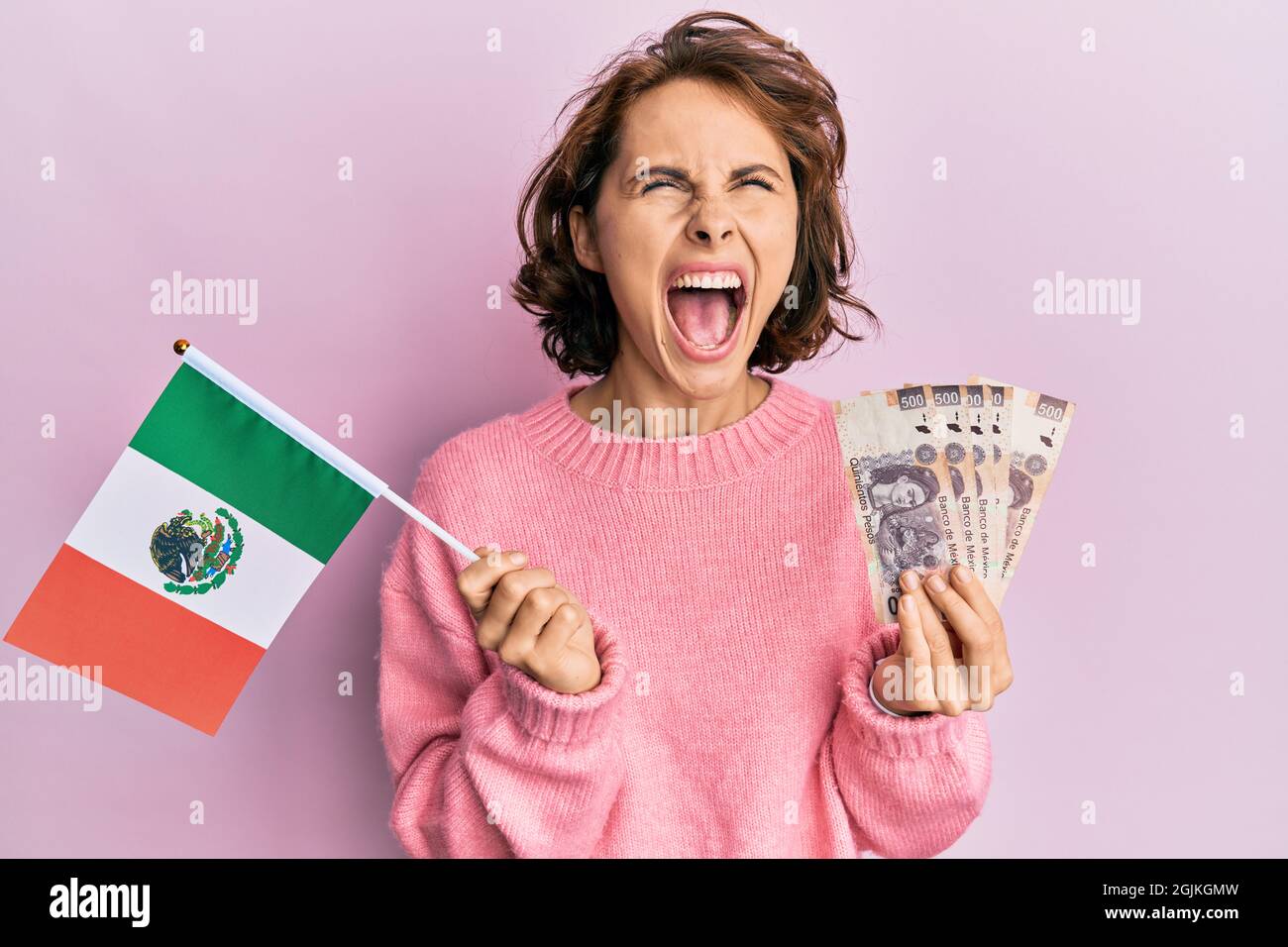 Young brunette woman holding mexico flag and mexican pesos banknotes ...