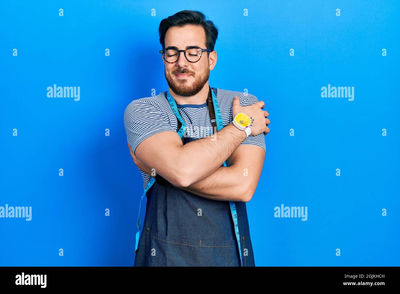 Handsome caucasian man with beard dressmaker designer wearing atelier ...