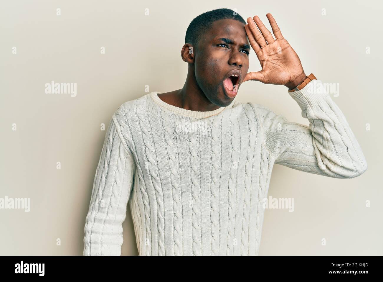Young african american man wearing casual clothes shouting and ...
