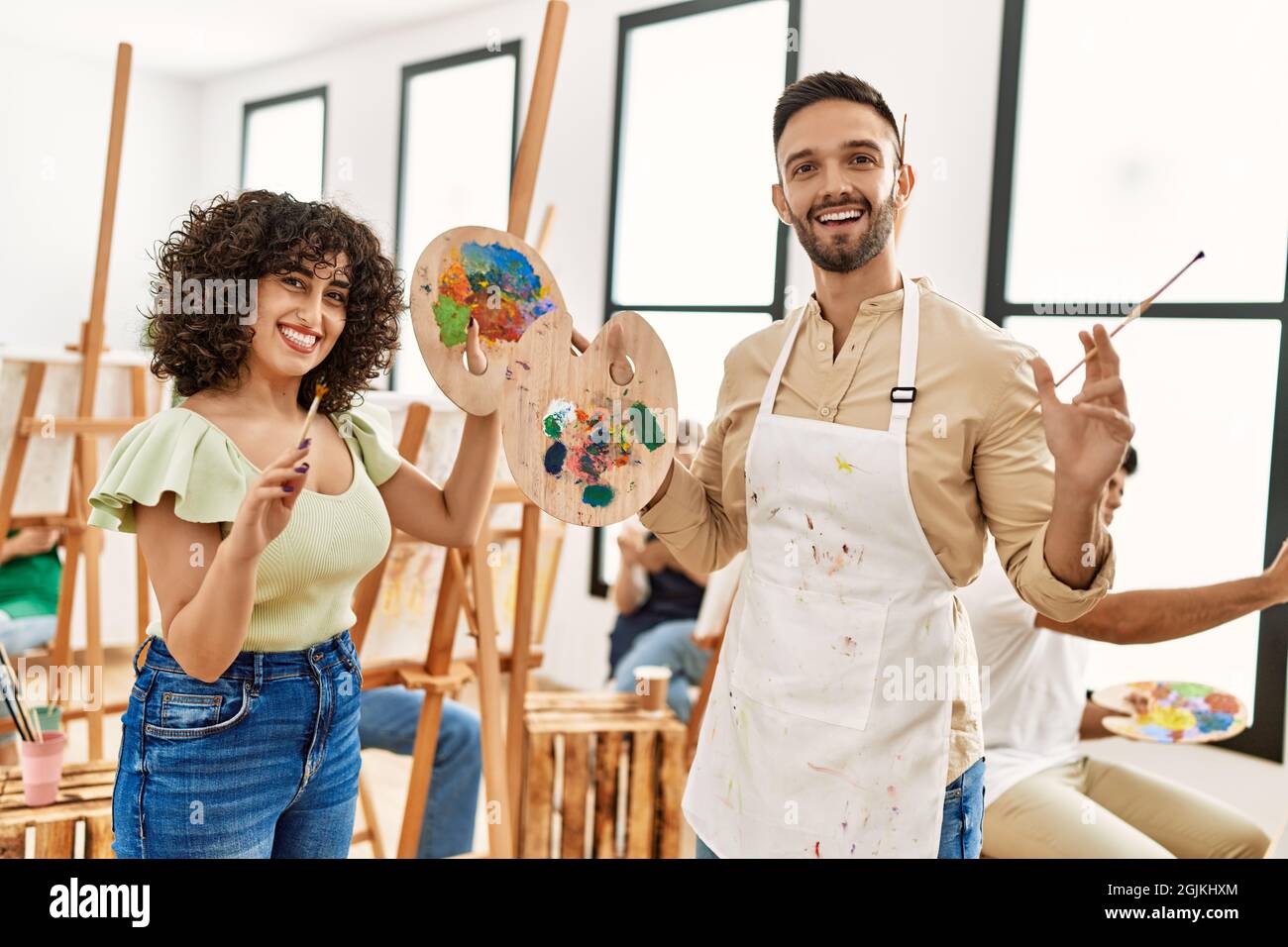 Group of people drawing at art studio. Man and woman smiling happy ...