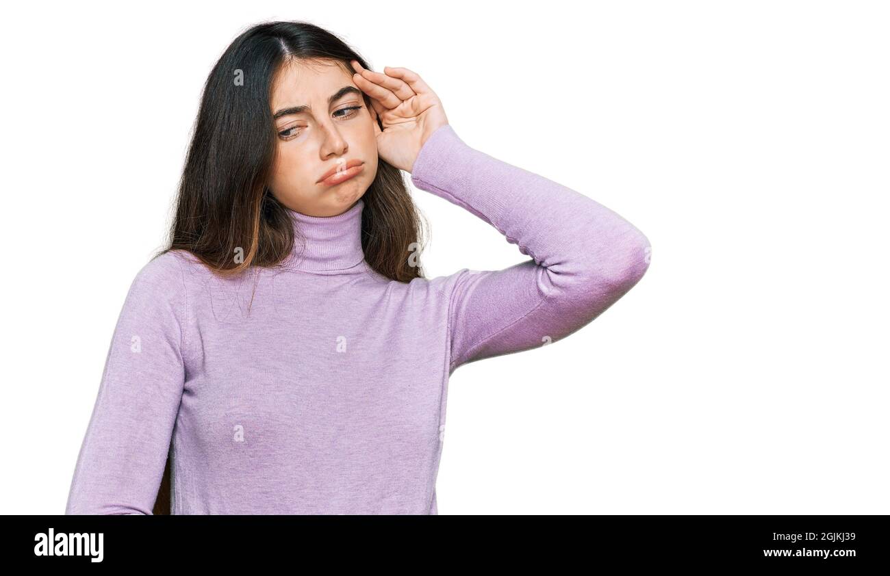 Young beautiful teen girl wearing turtleneck sweater worried and ...