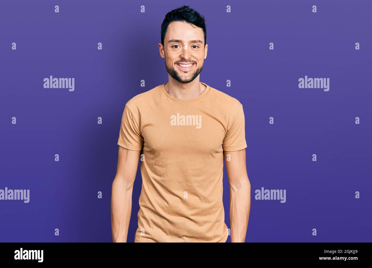 Hispanic man with beard wearing casual t shirt with a happy and cool ...