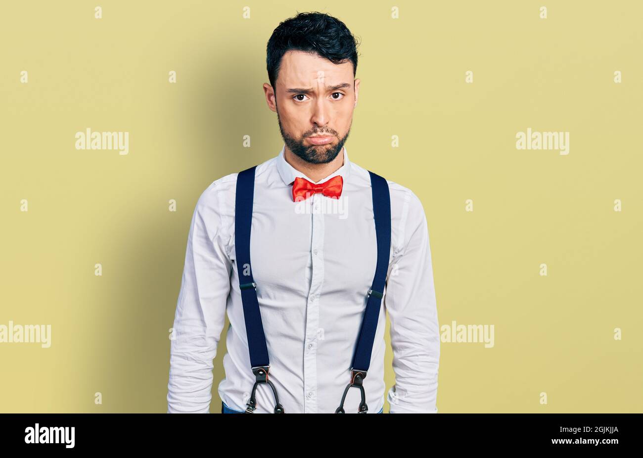 Hispanic man with beard wearing hipster look with bow tie and ...