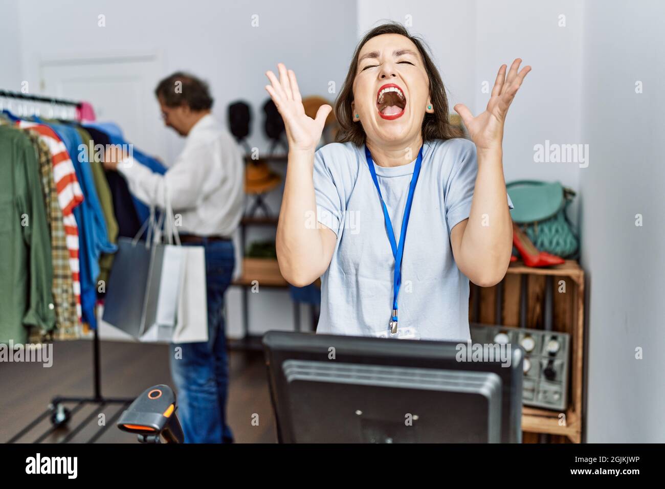 Middle age hispanic woman working as manager at retail boutique ...