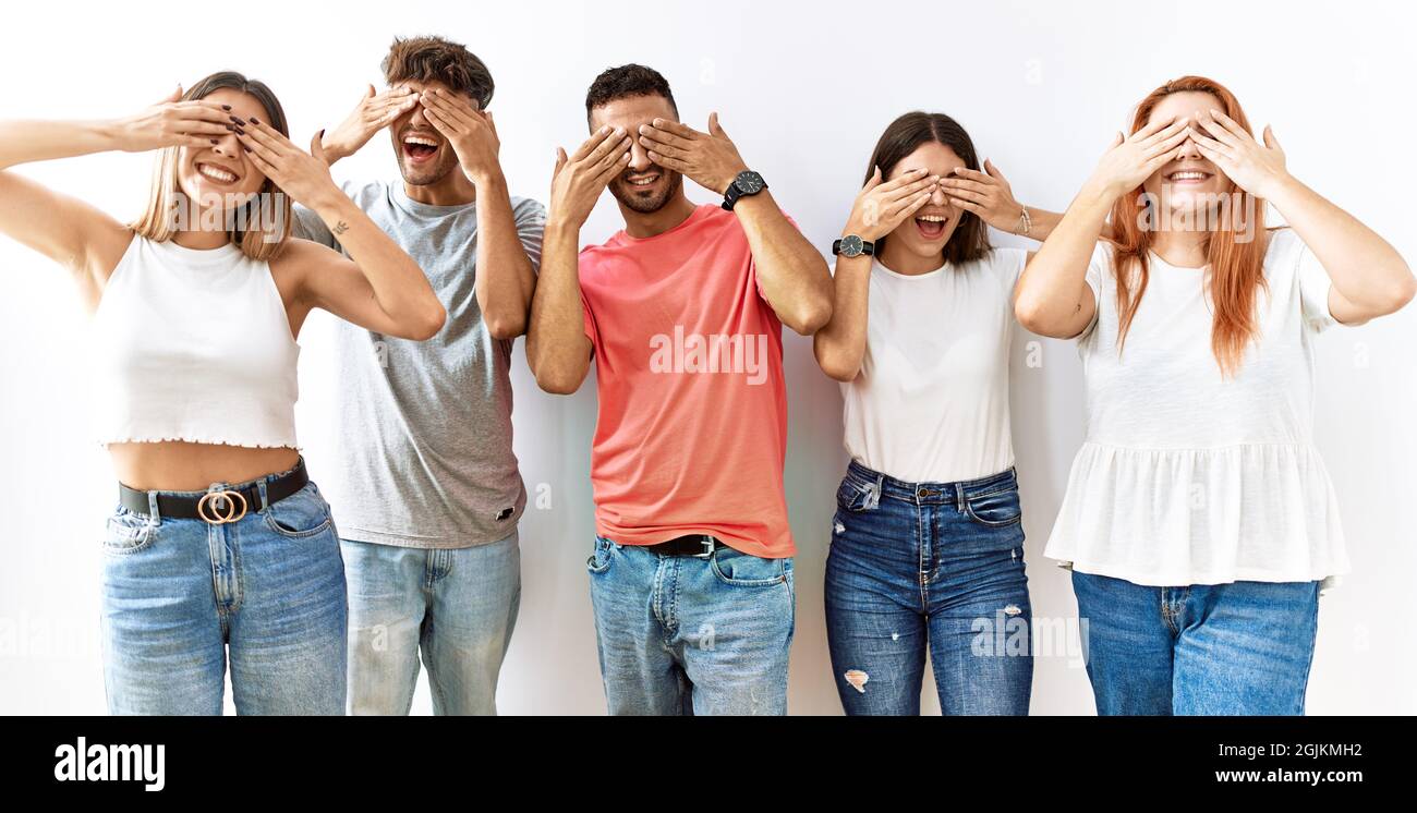 Group of young friends standing together over isolated background ...