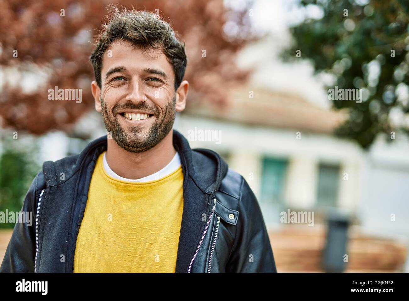 Handsome hispanic man with beard smiling happy outdoors Stock Photo - Alamy