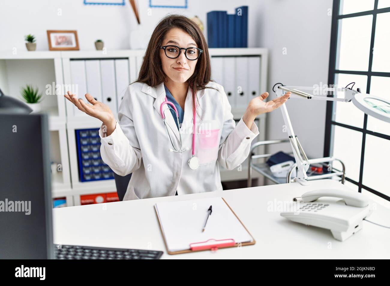 Young doctor woman wearing doctor uniform and stethoscope at the clinic ...
