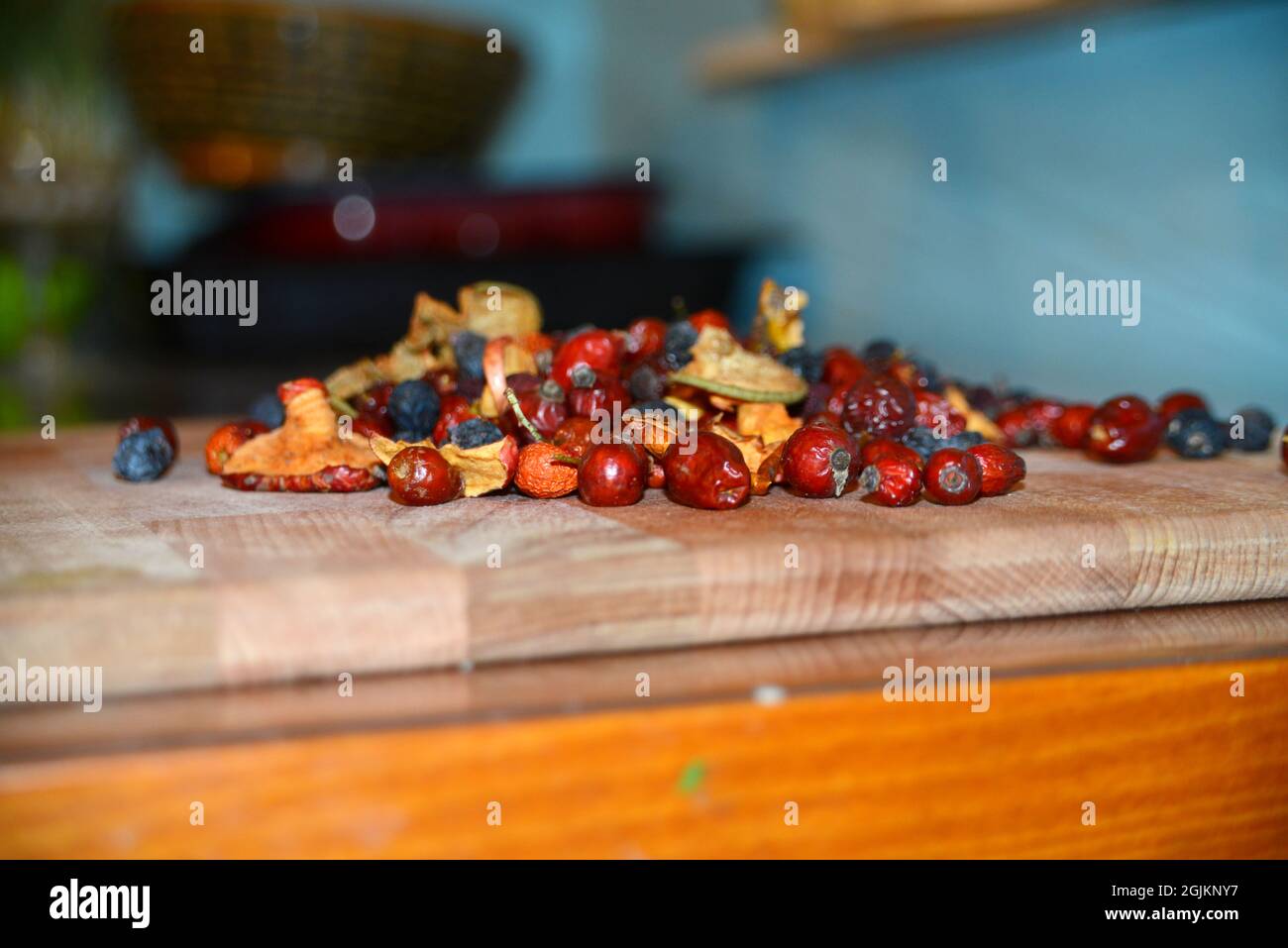 Mix of different dried forest fruits on wooden desk Stock Photo - Alamy