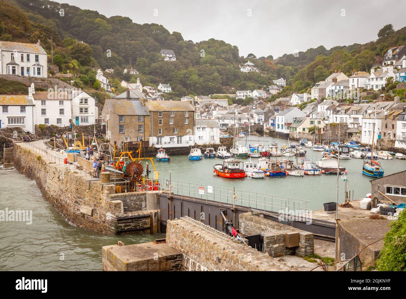 The inner harbour, quayside and fishing boats at Polperro, Cornwall UK ...