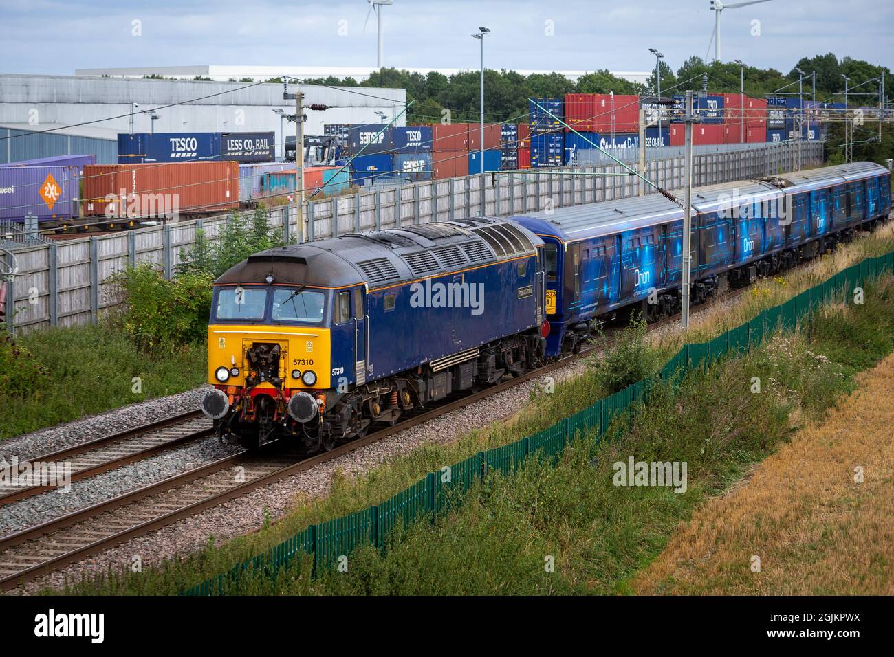 Class 57 - 57310 "Pride of Cumbria" hauling Orion Mail units past DIRFT ...
