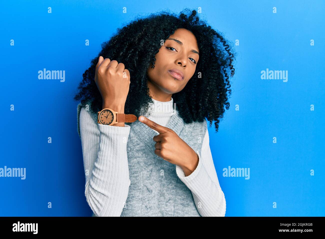 African american woman with afro hair wearing casual winter sweater in ...