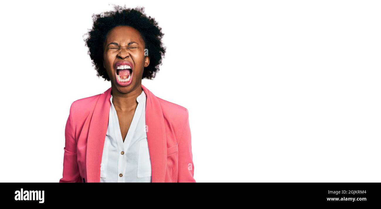 African american woman with afro hair wearing business jacket angry and ...