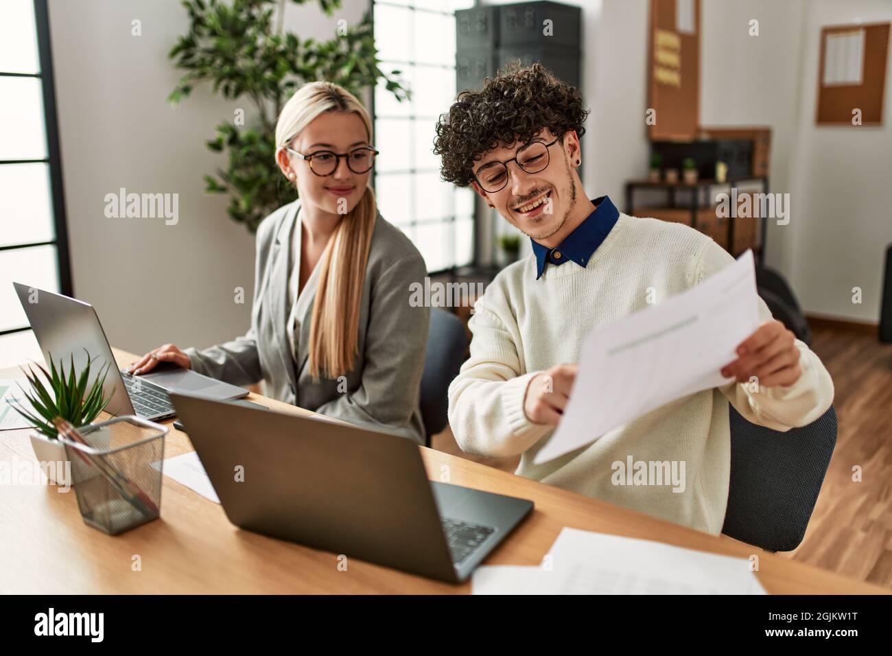Two business executives working at the office Stock Photo - Alamy