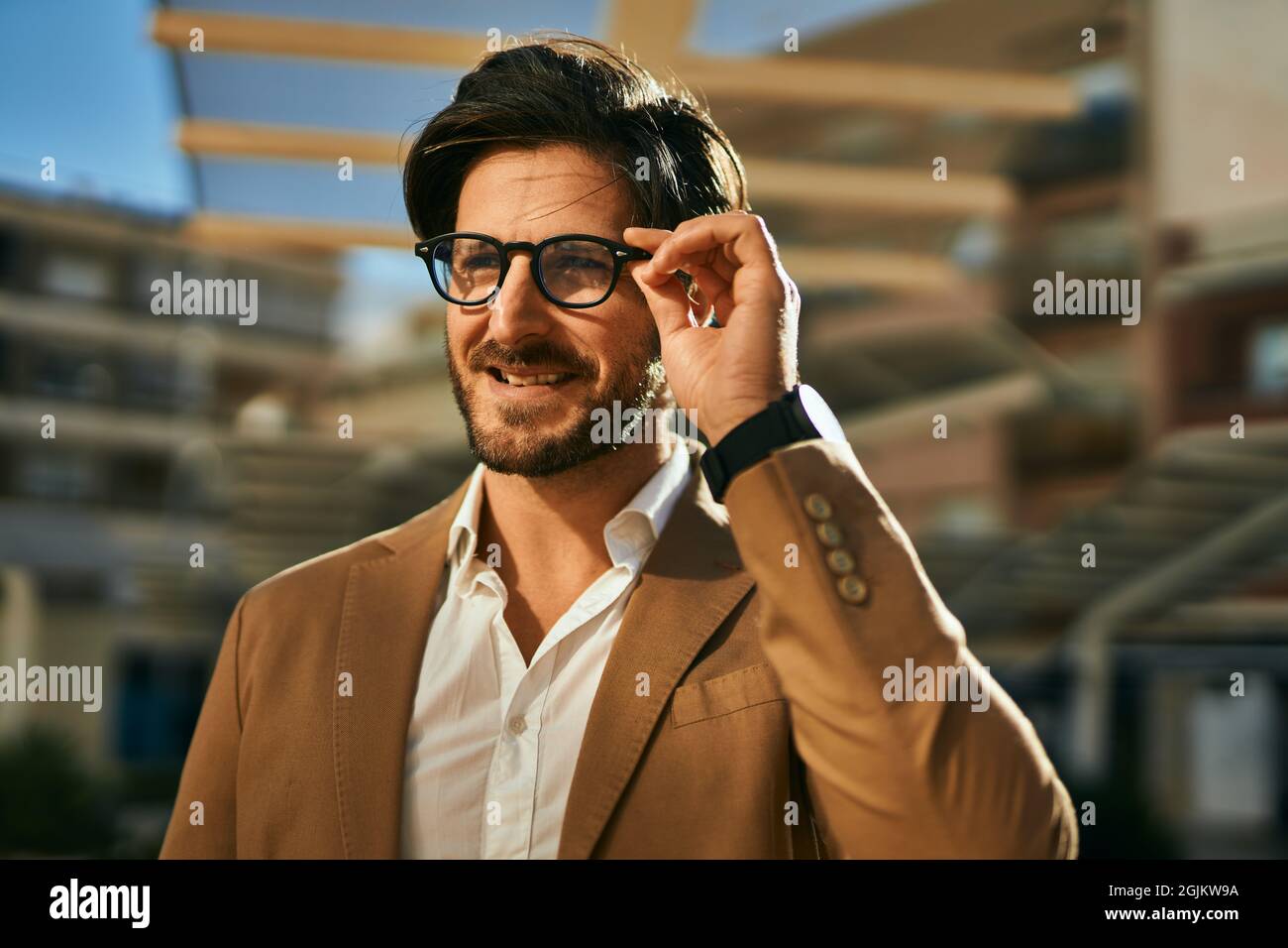 Young hispanic businessman smiling happy standing at the city Stock ...