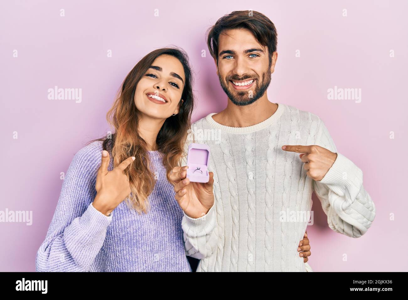 Beautiful couple of boyfriend and girlfriend holding engagement ring ...