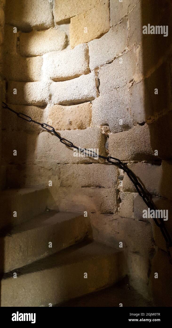 Stone spiral staircase with chain of handrails in Granadilla castle ...