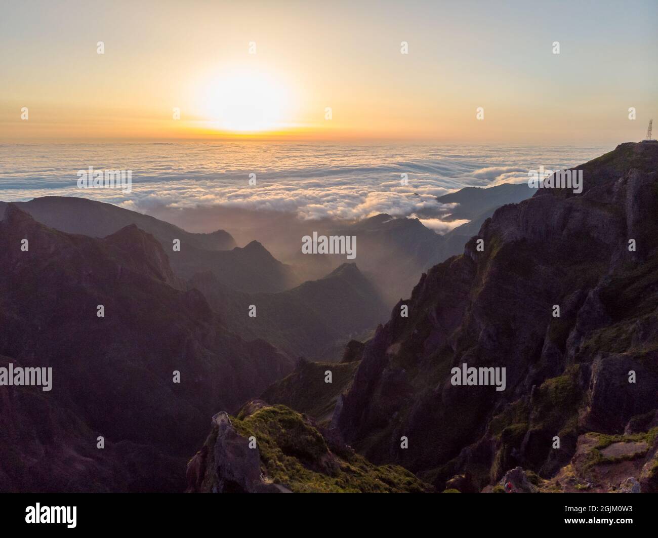 Spectacular landscape view of sunrise rising above sea of clouds ...