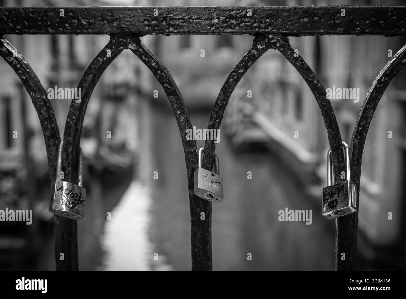 VENICE, ITALY - Jul 08, 2021: A grayscale closeup of the love locks on ...