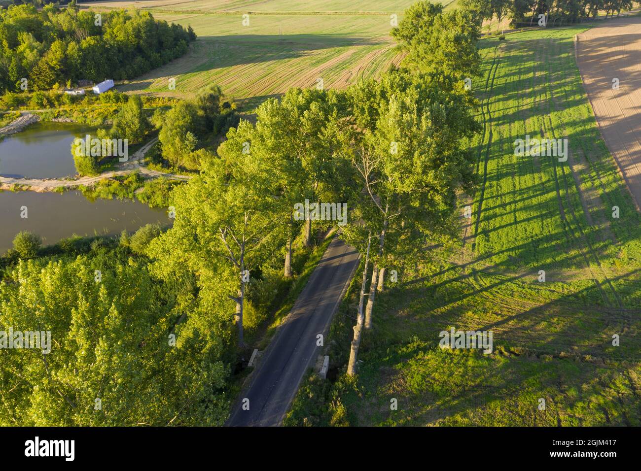 Asphalt road through farmland and meadows. View from the drone Stock ...