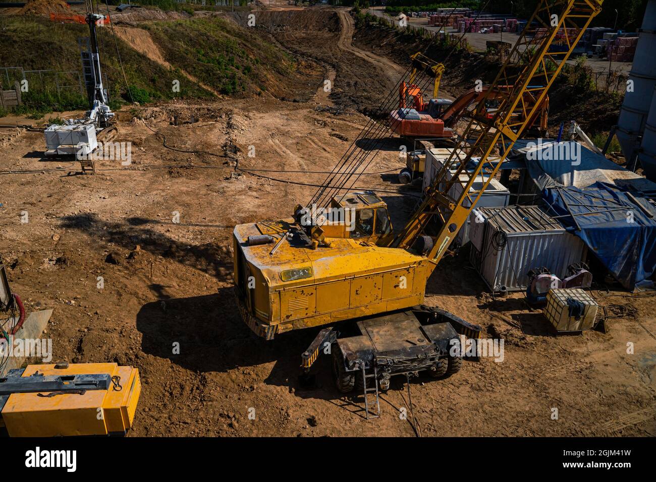 Yellow excavators at the construction of a new road in Kazan, Russia ...