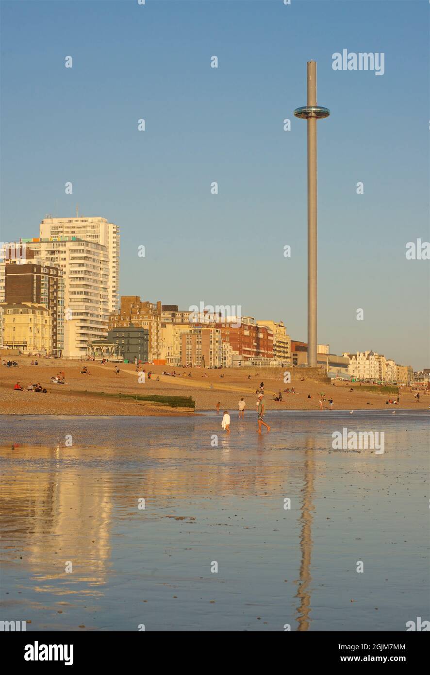 The i360 observation tower against a blue sky, and the beach at low ...