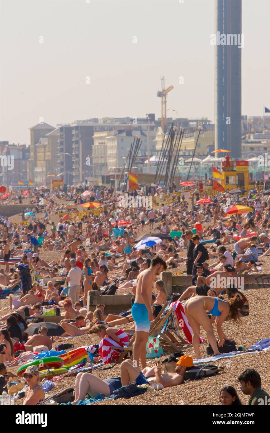 Crowded beaches of central Brighton and Hove. West of Brighton's Palace ...
