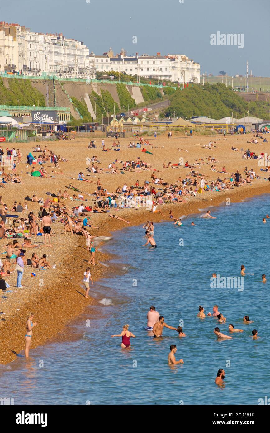Crowded beack of Kemptown, Brighton. East of Brighton Palace Pier ...