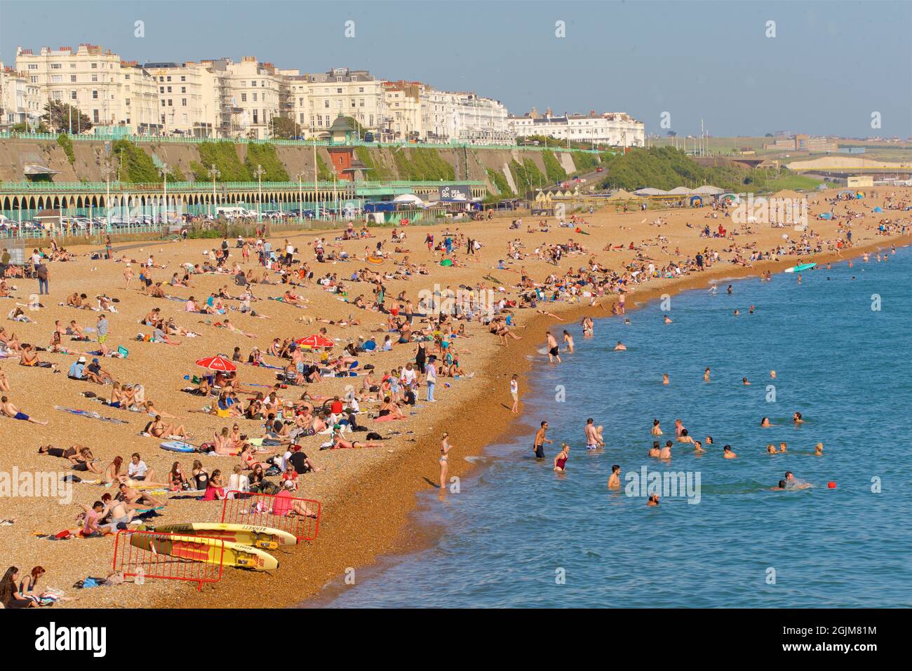 Crowded beack of Kemptown, Brighton. East of Brighton Palace Pier ...