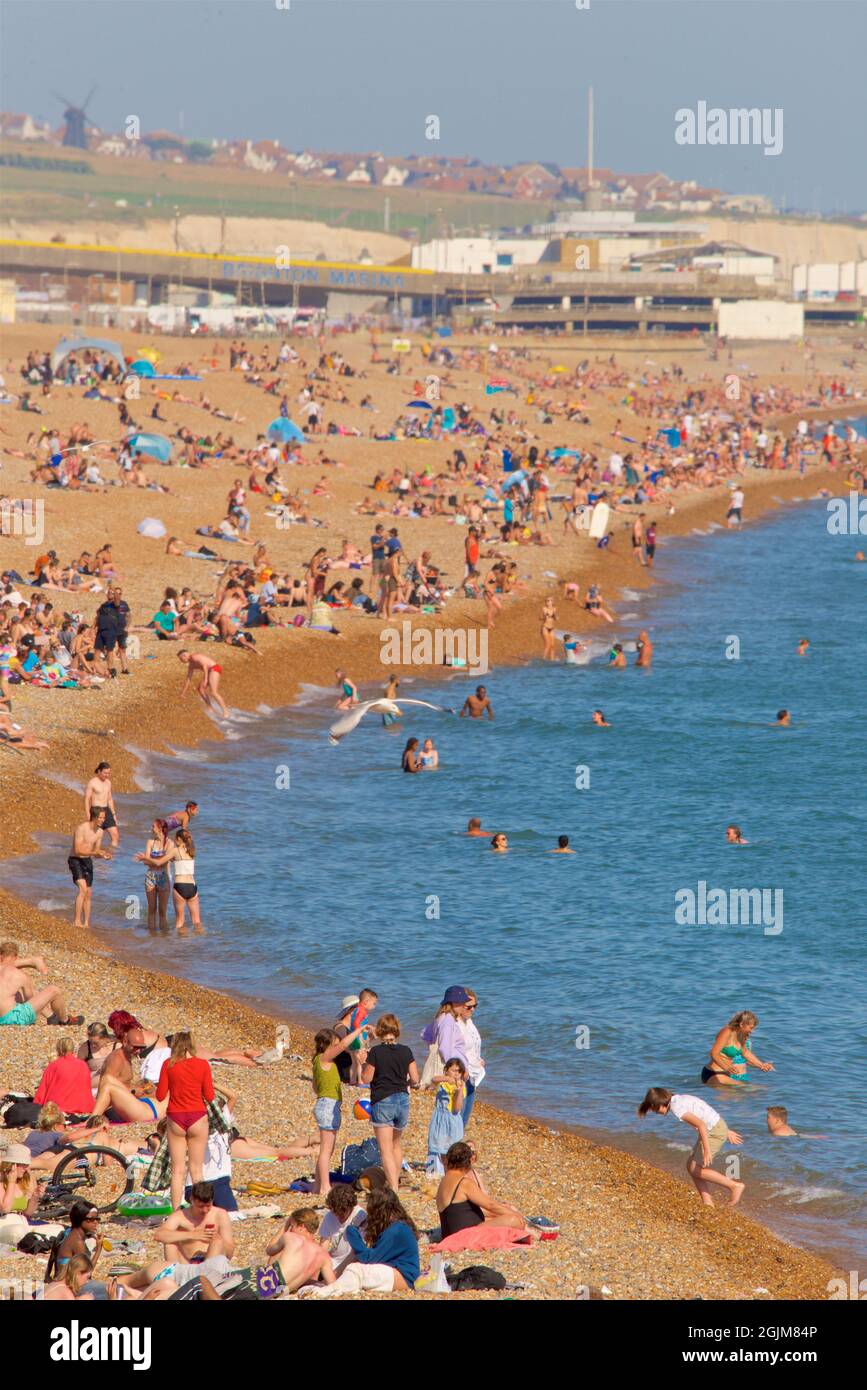 Crowded beack of Kemptown, Brighton. East of Brighton Palace Pier ...