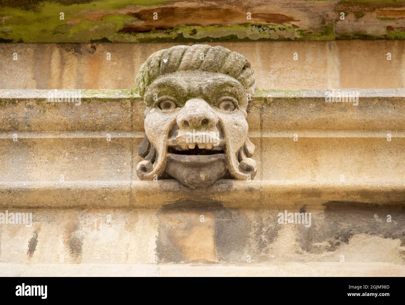 Stone carved decoration. Gargoyle. Face on exterior of the Bodleian ...