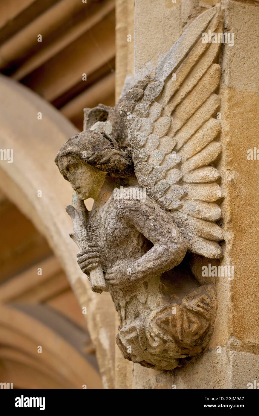 Stone carved angel on the exterior of Magdalen College, University of ...