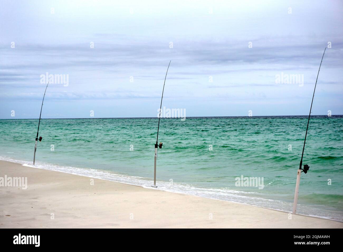 Fishing in emerald water at white sandy beach of Destin Beach, Destin ...
