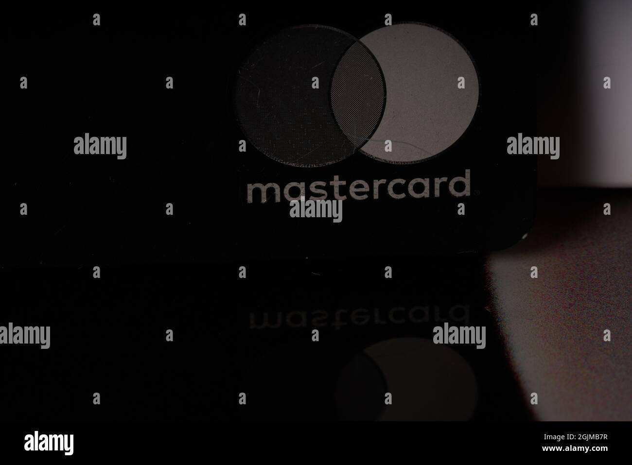 MasterCard Worldwide logo with scratches on the glass table with ...