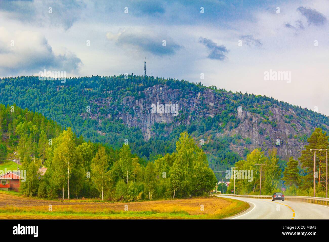 Driving through Agder Kristiansand Norway in summer with a view of ...